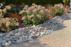 10 Easy and Affordable Flower Bed Ideas with River Rock to Create the ...